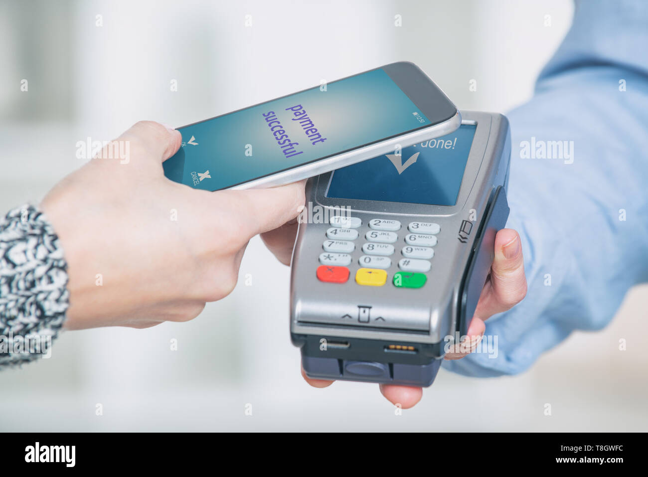 Making contactless payment with smart phone over payment terminal at ...