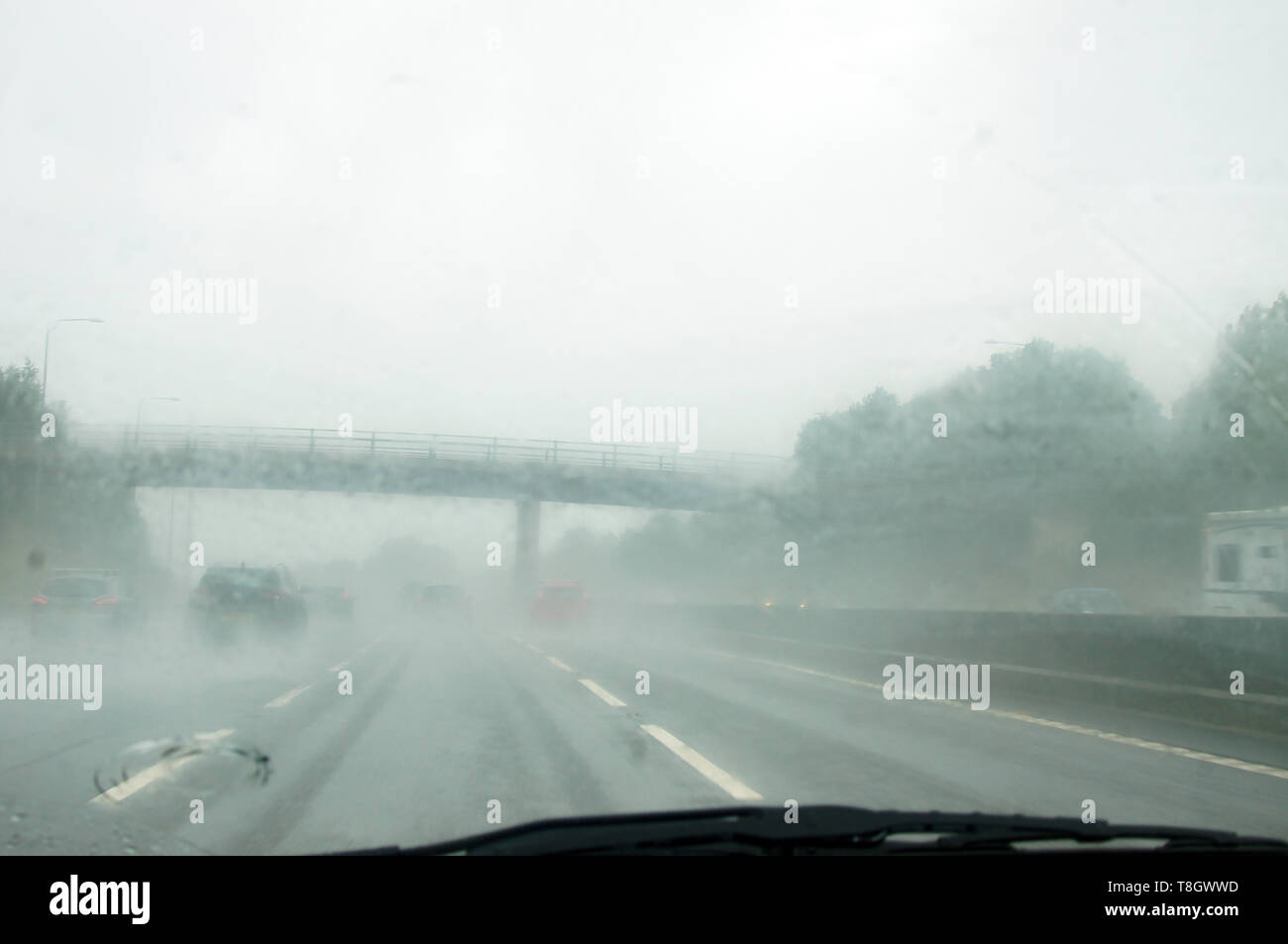 Car moving through rainy road hi-res stock photography and images - Alamy