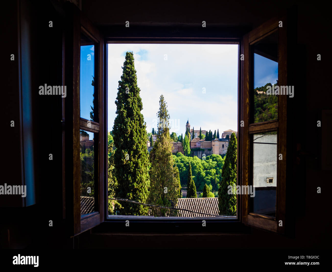 the alhambra in Granada seen through a wooden window Stock Photo - Alamy