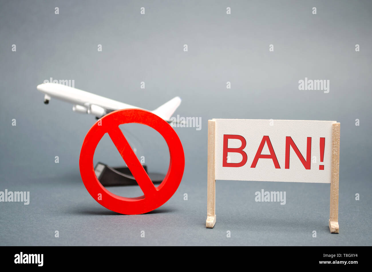 A poster with the word Ban. The sign of the ban and a miniature toy ...
