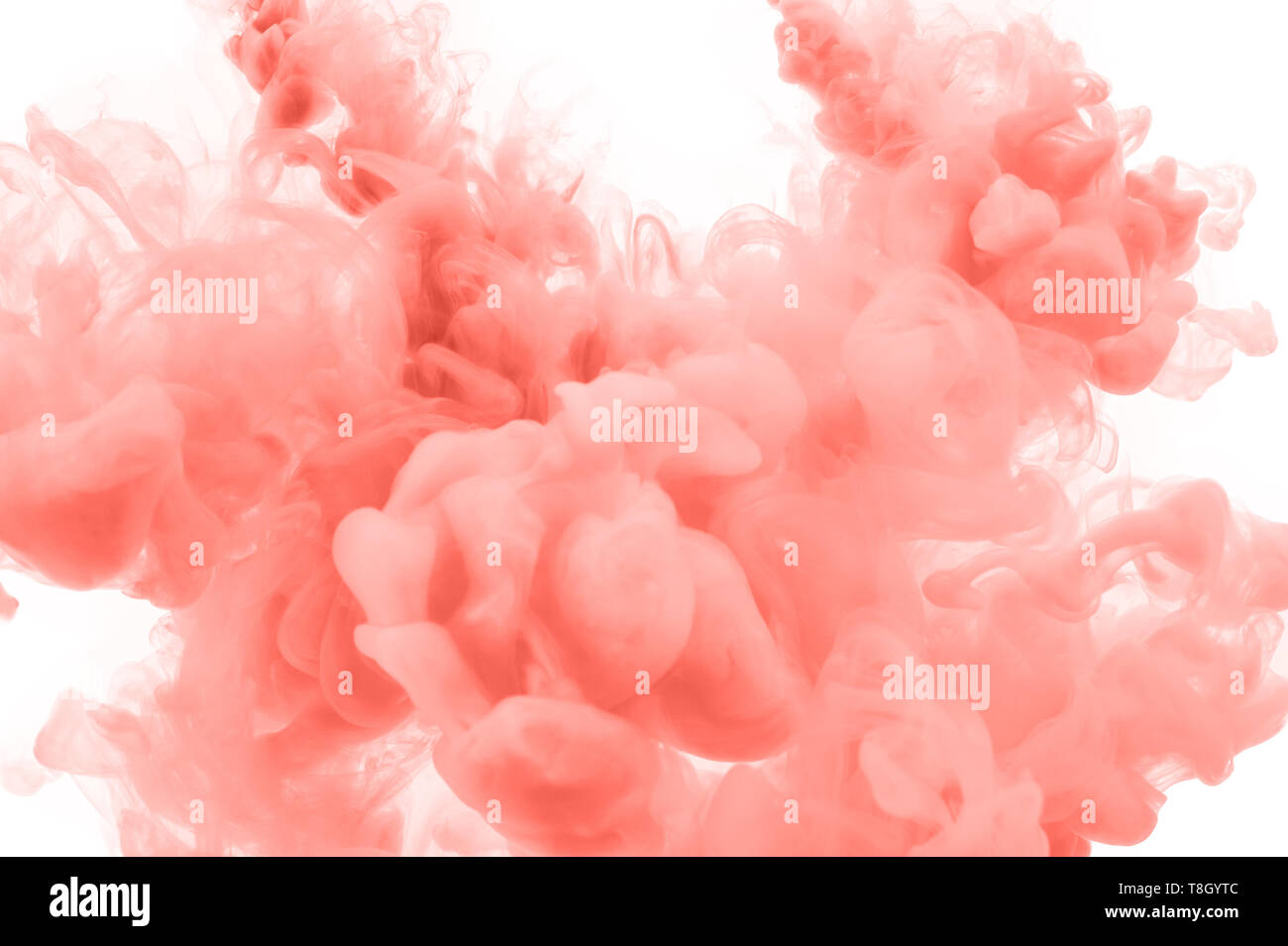 Coral ink splashes in the water. Abstract background for your design ...