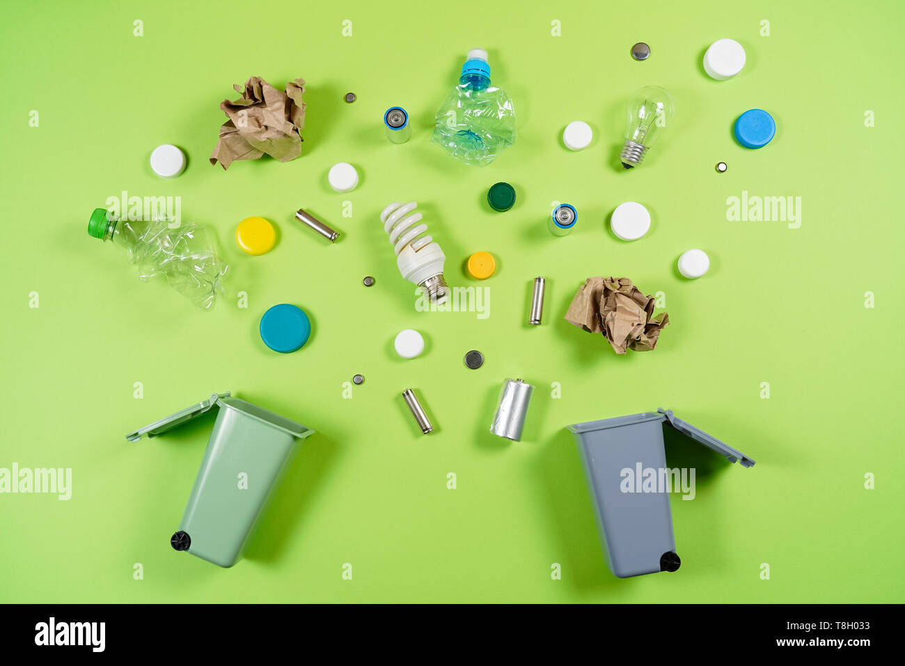 Trash bins and assorted garbage isolated on green, recycle concept, Top ...