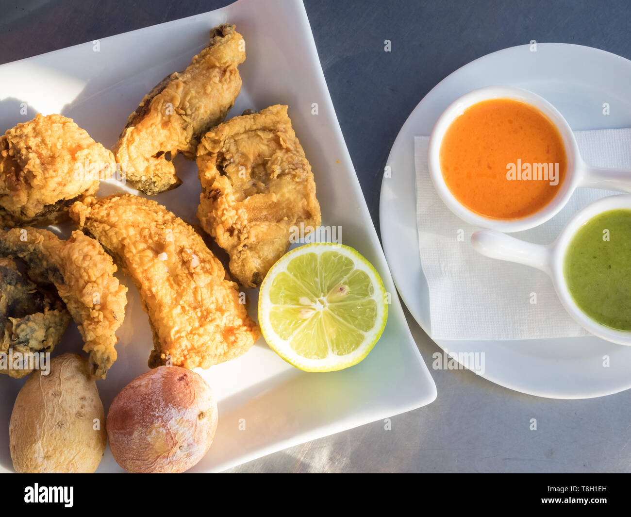Fried moray eel with salt potato, accompanied by mojo picon and green ...