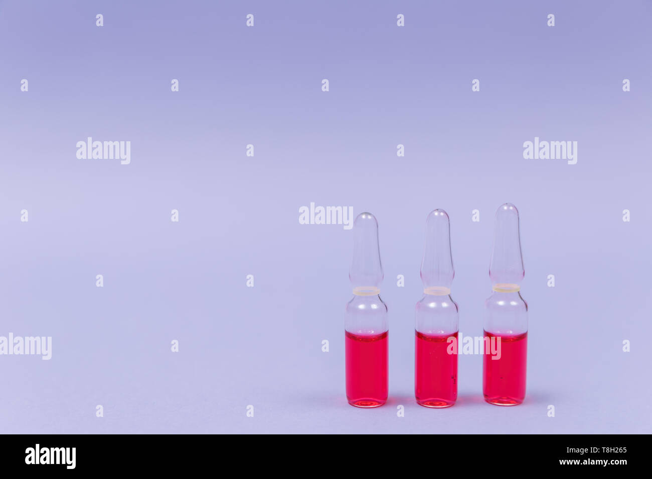 Injection bottle on background with copy space Stock Photo - Alamy