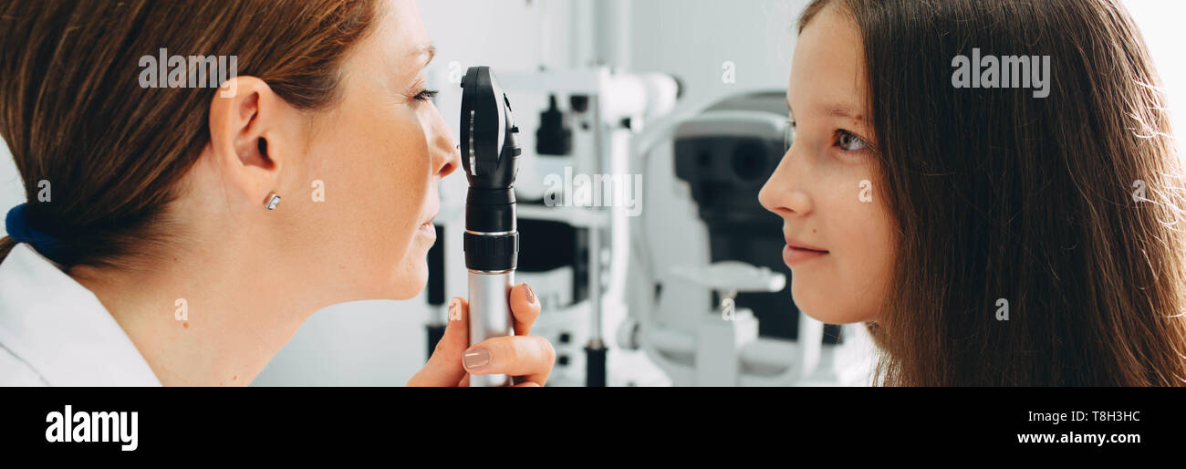 girl-getting-eye-exam-at-doctors-office-children-eye-examination
