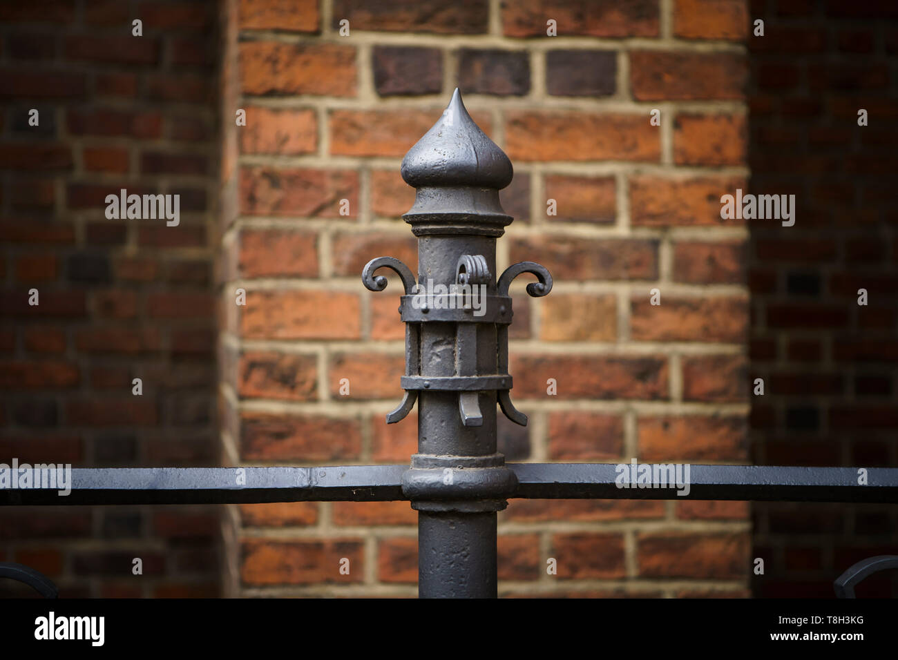 Ancient metal fence outside old catholic church in European city.Black ...