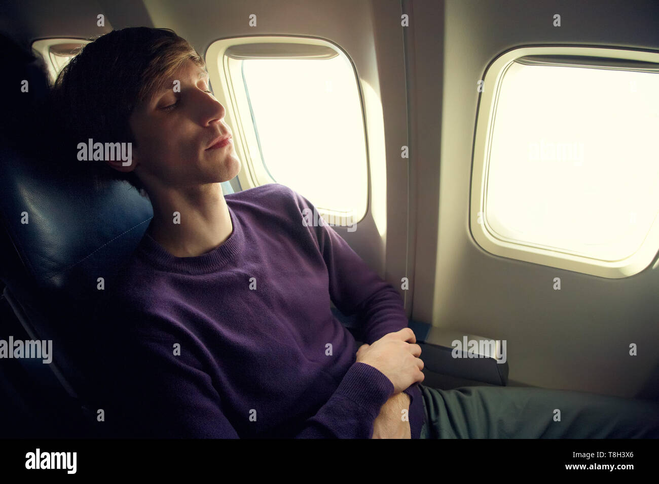 Man in plane seat hi-res stock photography and images - Alamy
