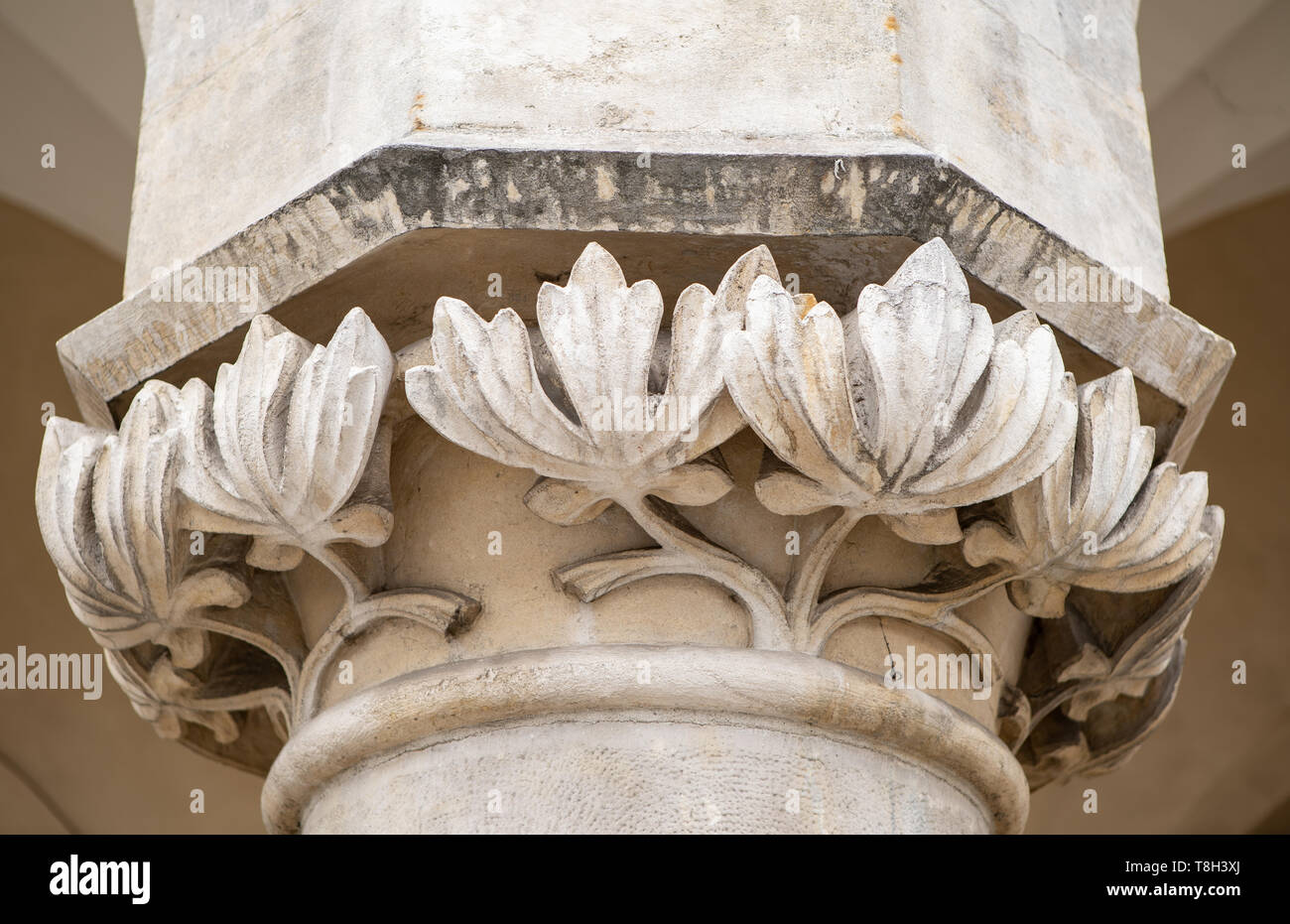 Vintage stone column with decor.Classic roman columns in building ...