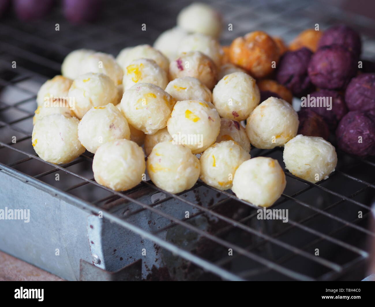 Grilled Purple Sweet Potato grill on steel grille Thai Dessert Stock ...