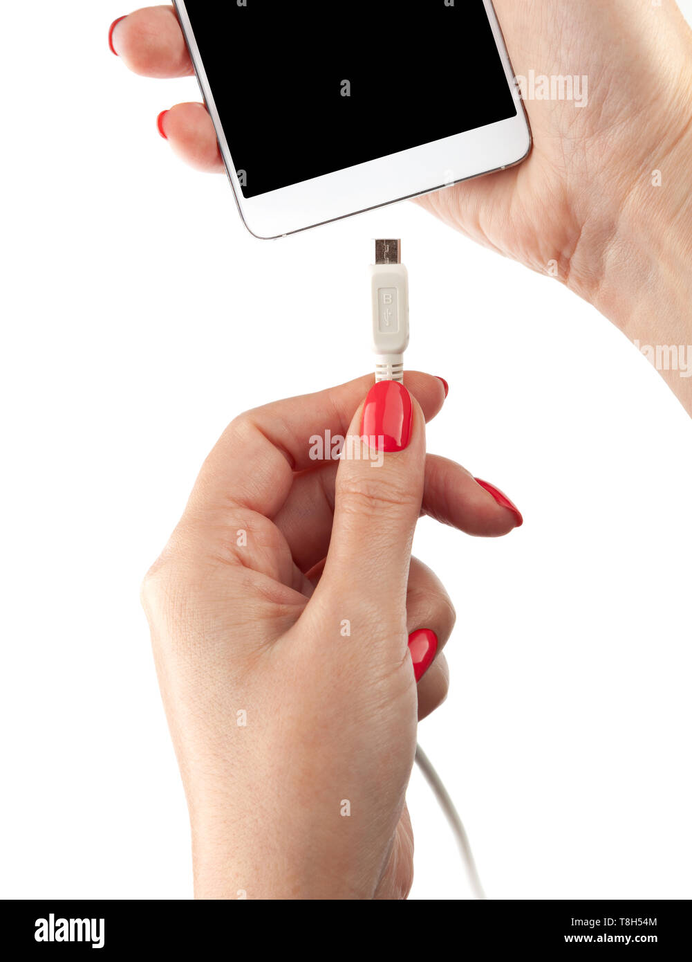 Smartphone in the hand of a woman. Connect the USB cable charger Stock ...