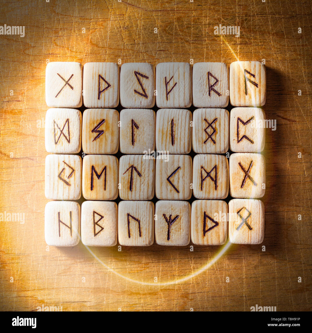 Set of Handmade scandinavian wooden runes on a wooden vintage ...