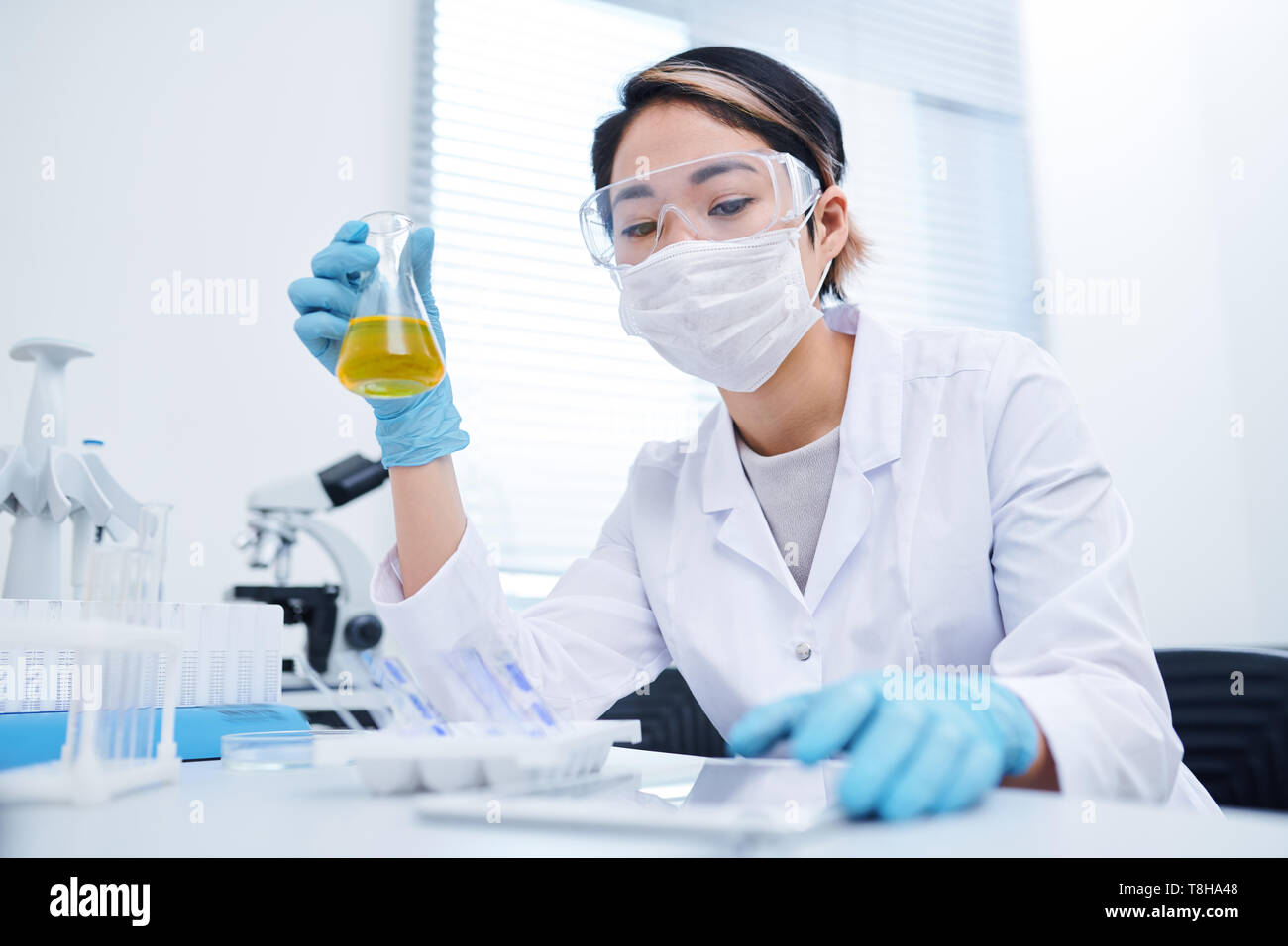Lab technician processing specimen Stock Photo - Alamy
