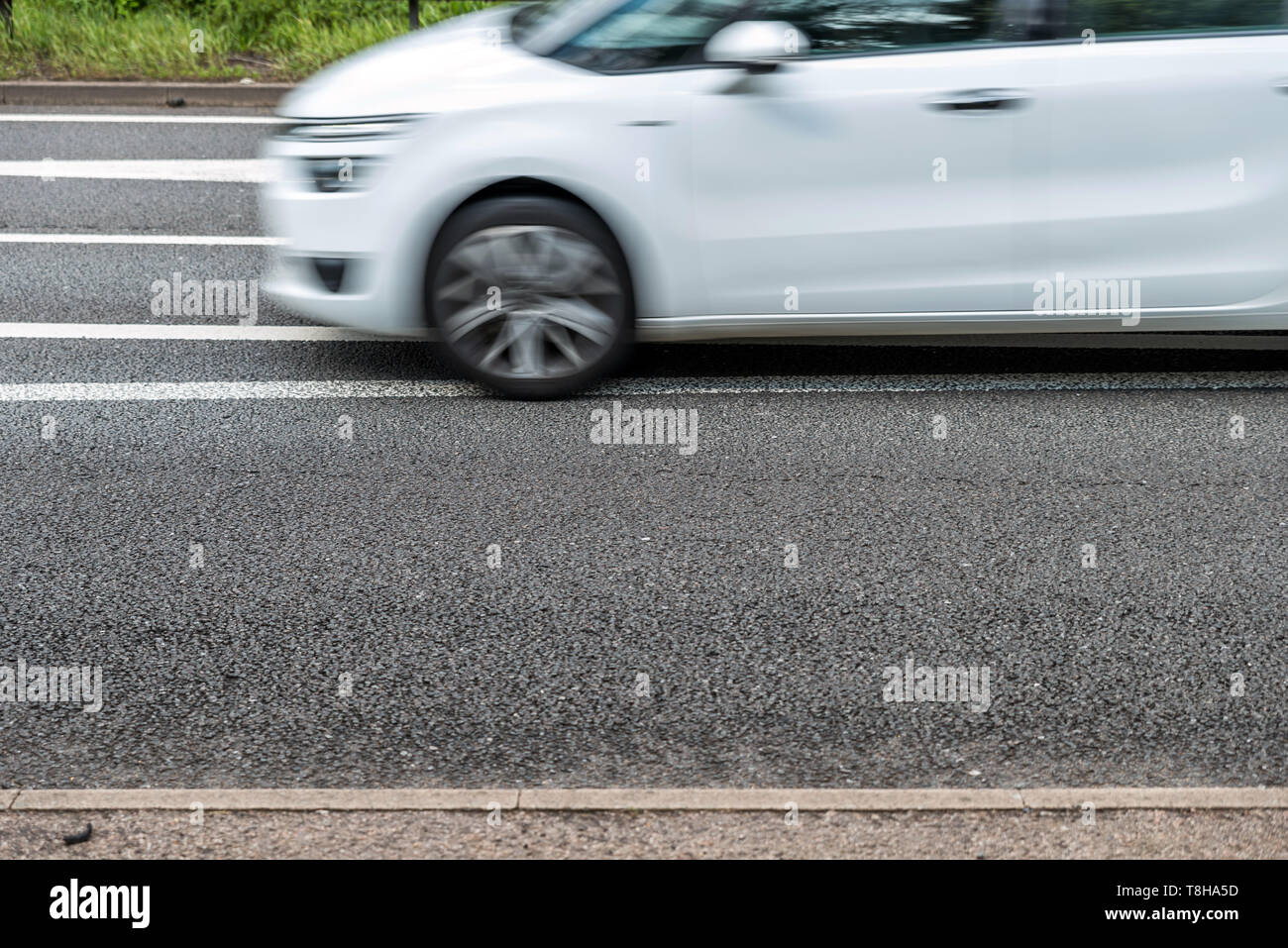 white mpv on uk motorway in fast motion Stock Photo - Alamy
