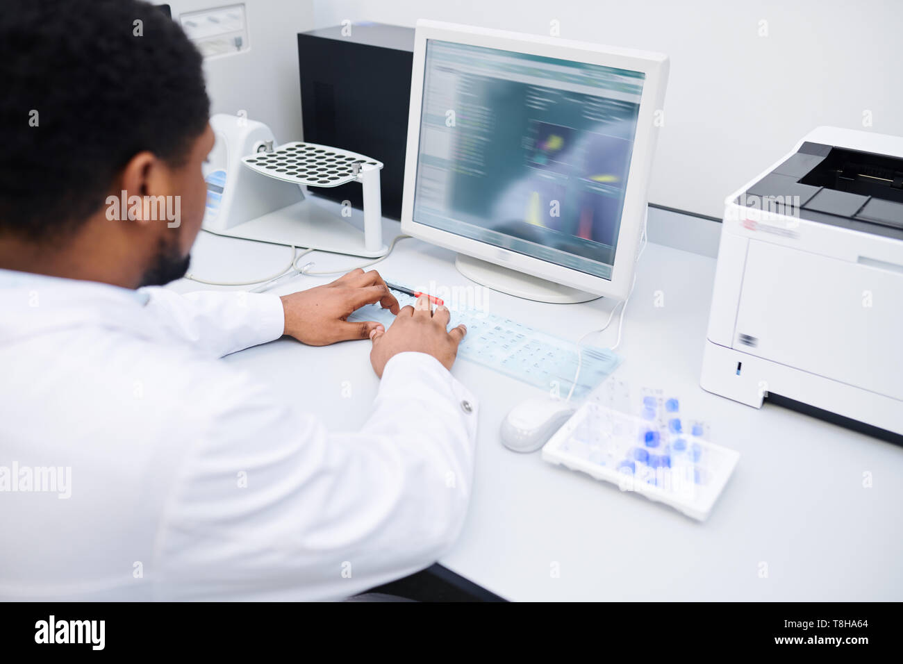 Experimental scientist recording data Stock Photo - Alamy