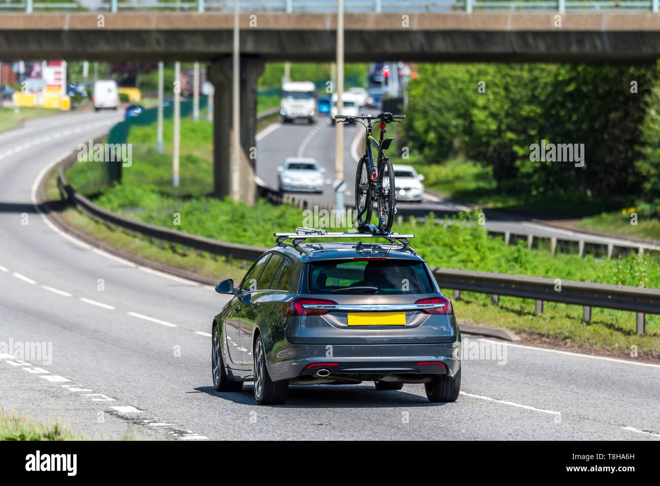car with bike on uk motorway in fast motion Stock Photo - Alamy