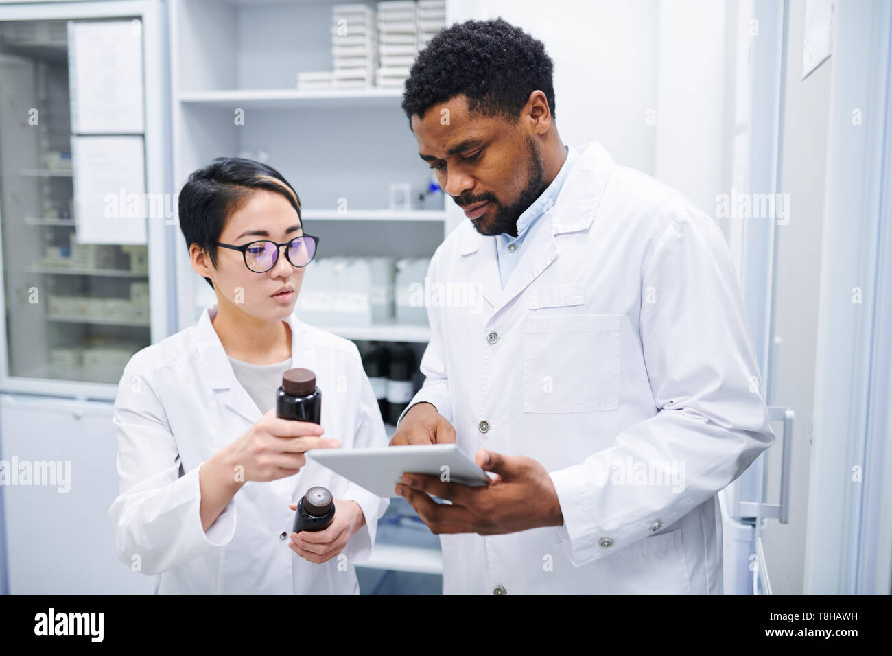Pharmacists discussing new medications Stock Photo - Alamy