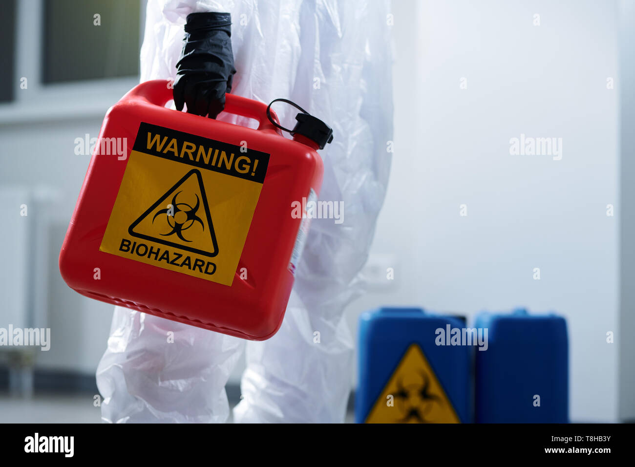 Carrying container with biohazard Stock Photo - Alamy