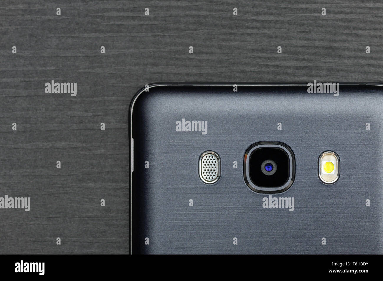 Closeup the camera is part of the black phone and the microphone on the ...