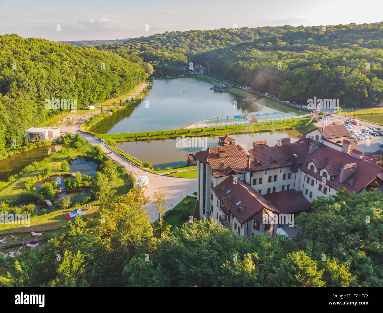 aerial view of resort near lake forest around. sunny evening Stock ...