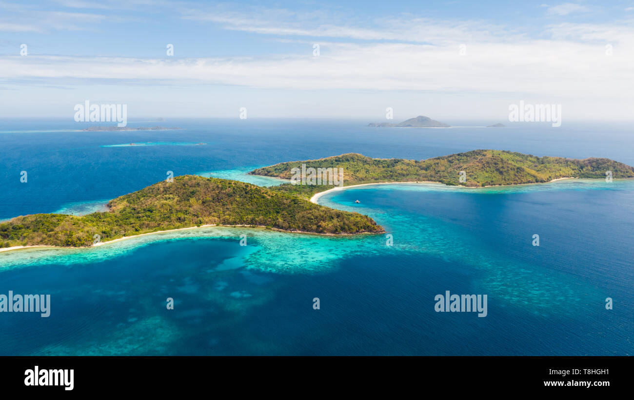 aerial seascape tropical island with sand bar, turquoise water and ...