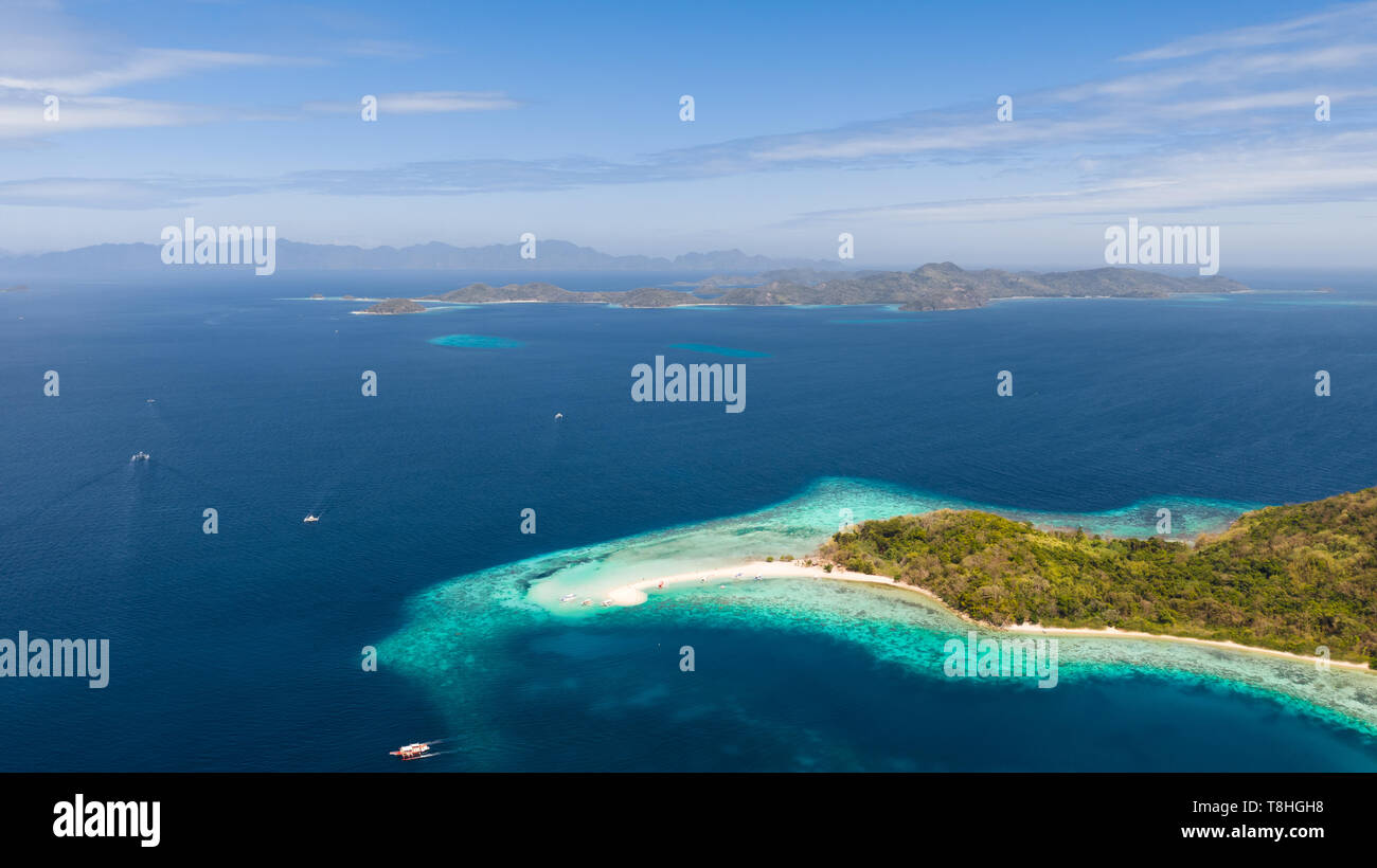 aerial seascape tropical island with sand bar, turquoise water and ...