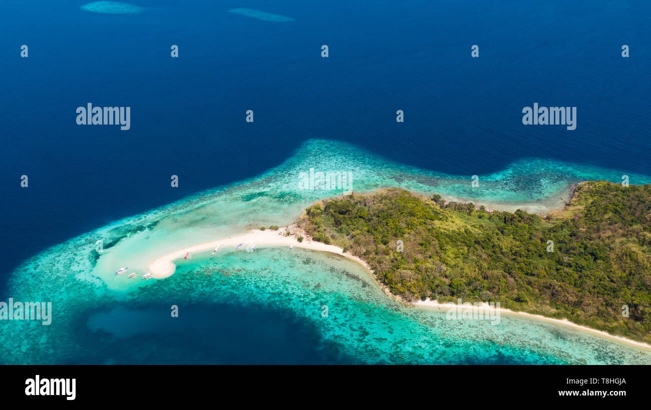 aerial seascape tropical island with sand bar, turquoise water and ...