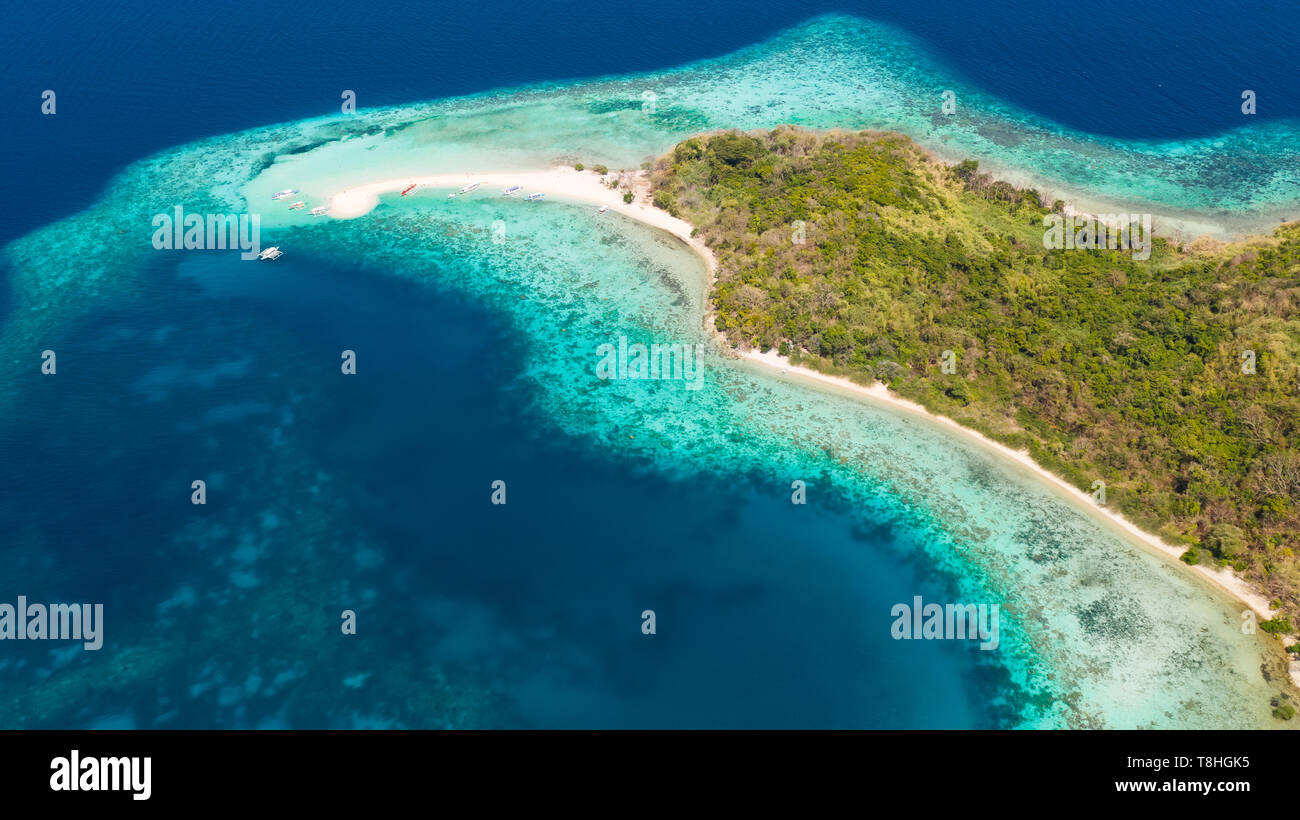 aerial seascape tropical island with sand bar, turquoise water and ...