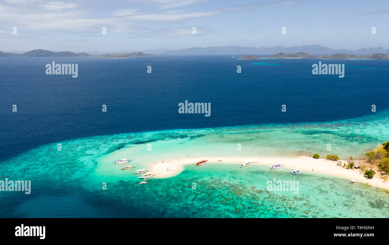 aerial seascape tropical island with sand bar, turquoise water and ...
