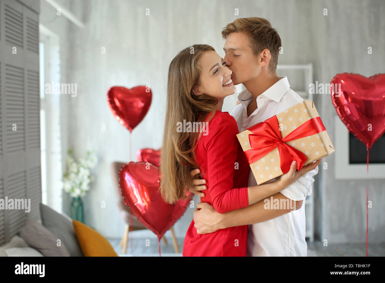 Woman hugging red box hi-res stock photography and images - Alamy