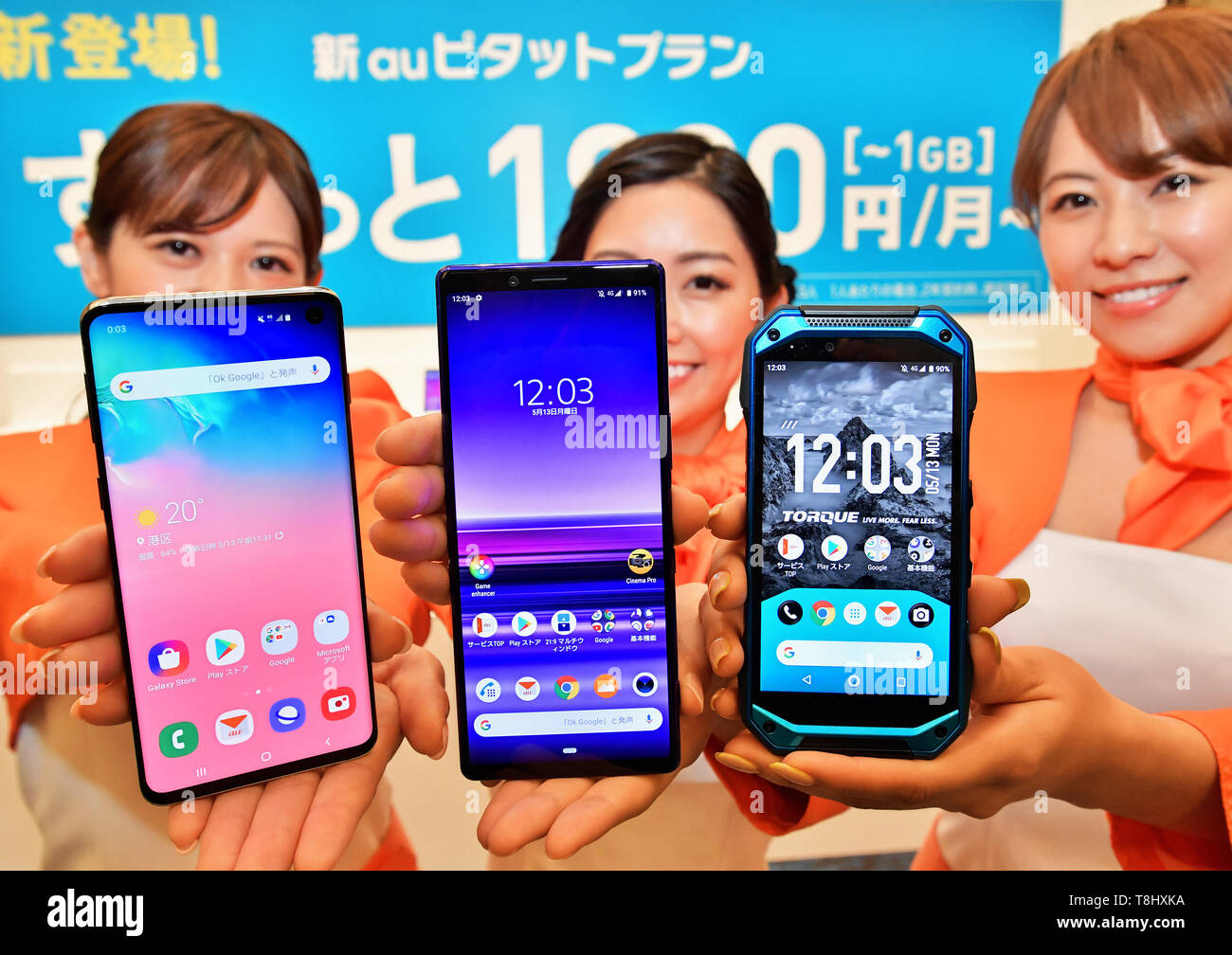 A model show new mobile devices (L-R, Galaxy S10 of Samsung, XPERIA 1 ...