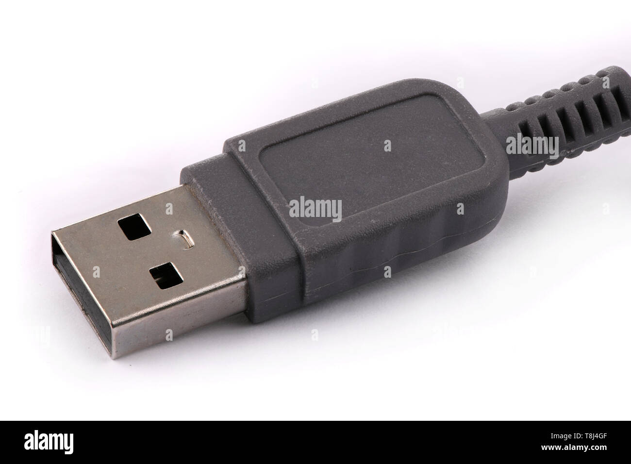 Black USB connector cable isolated on white background with soft shadow ...