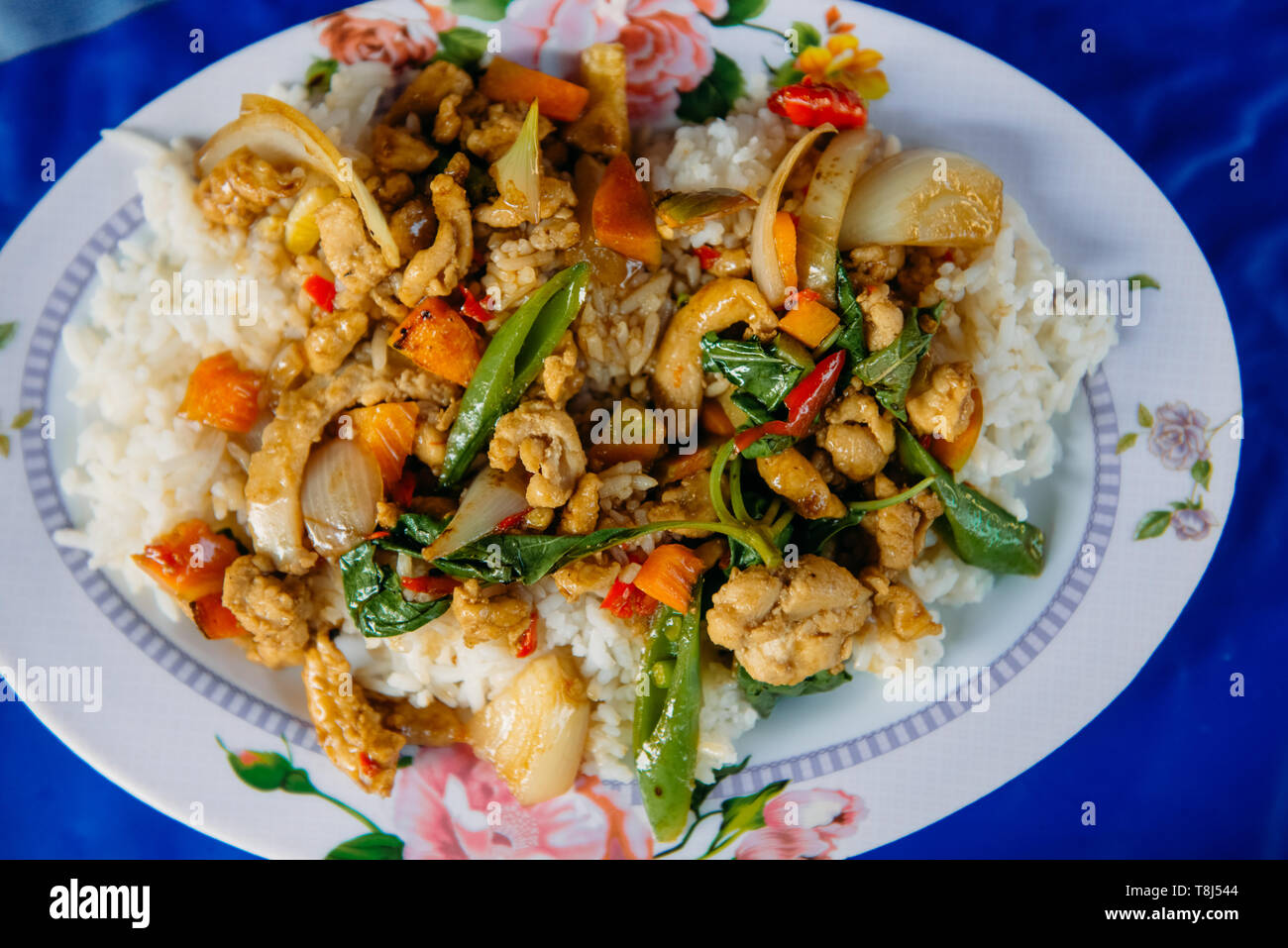 Chicken and vegetable stir fry with rice, Krabi, Thailand Stock Photo ...