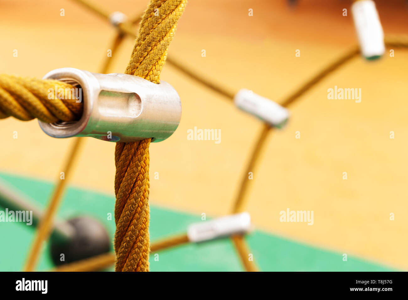 metal braided rope fastening on colored background Stock Photo - Alamy