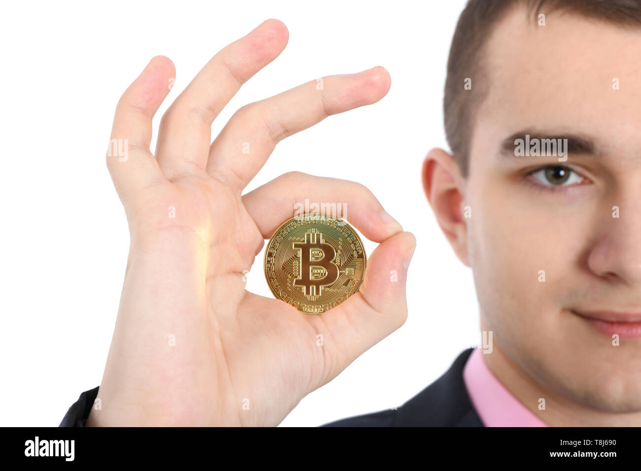 Man holding golden Bitcoin isolated on white background. High ...