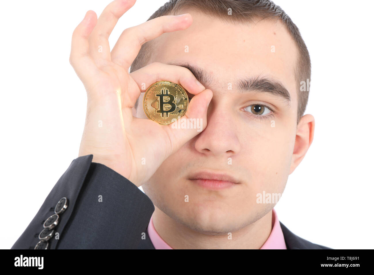 Man keeps the eye instead two golden cryptocurrency bitcoin in hands on ...