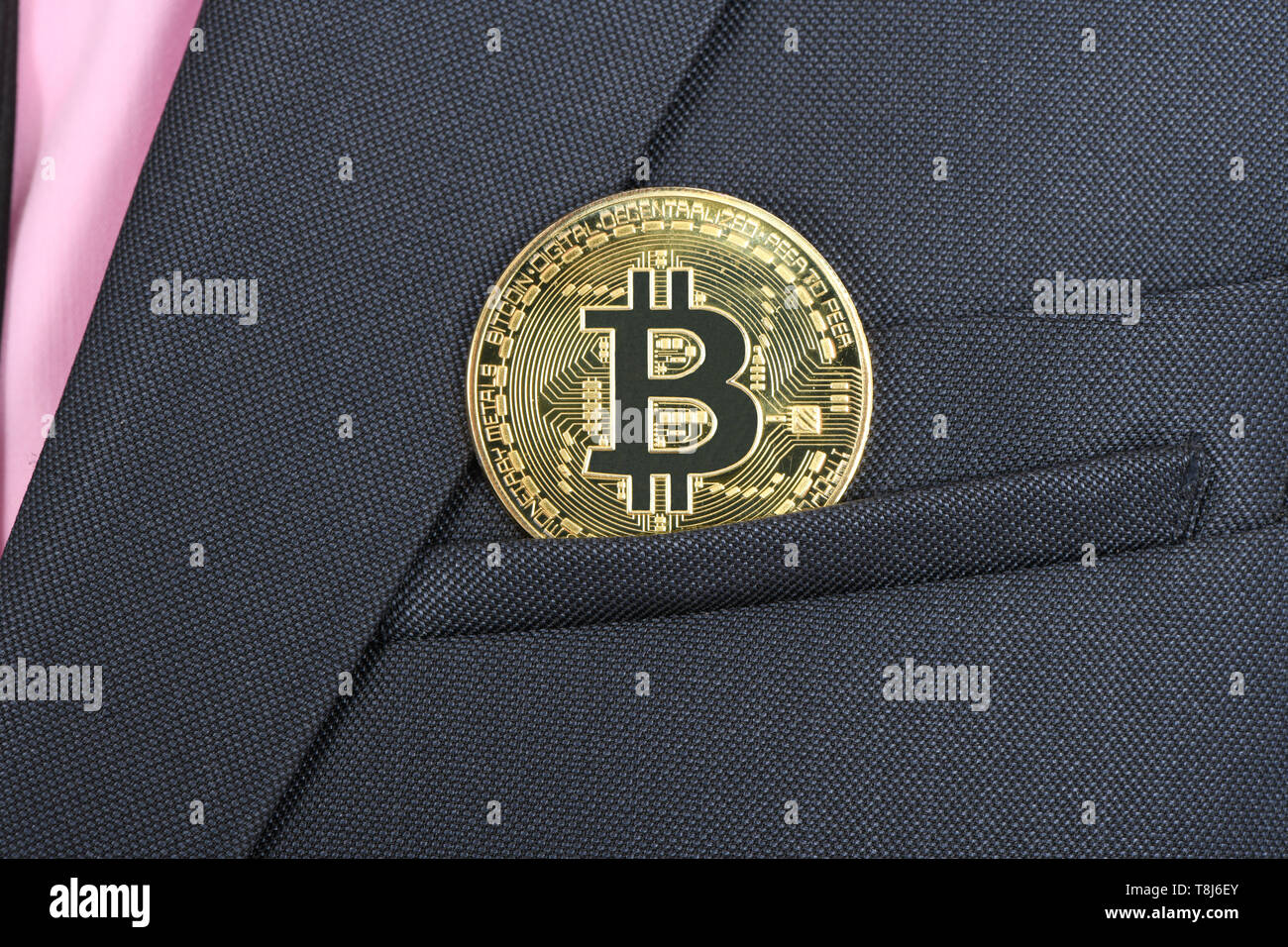 Bitcoin in jacket pocket. High resolution photo. Full depth of field ...