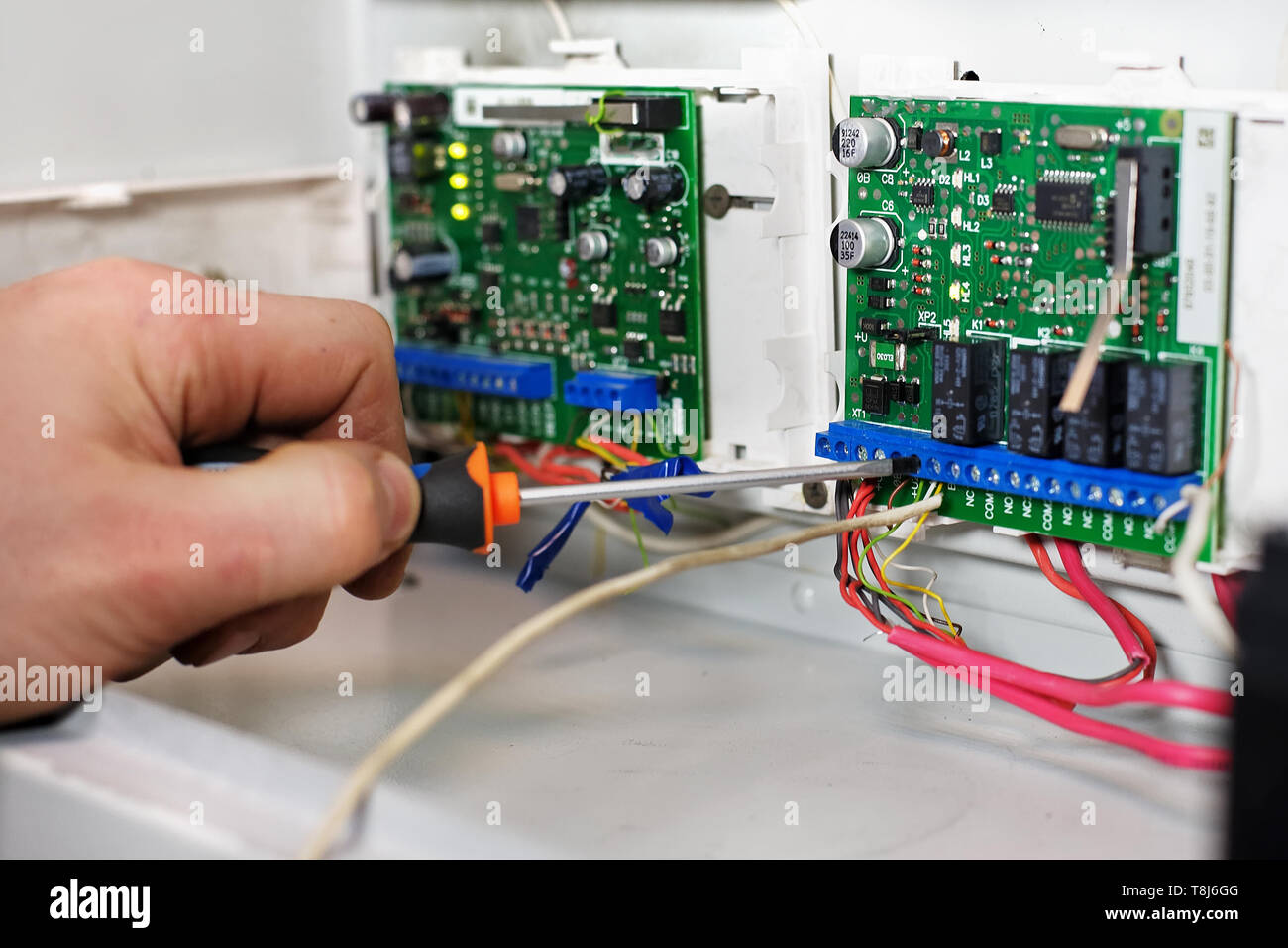 The mechanic on control and measuring devices makes repair and ...