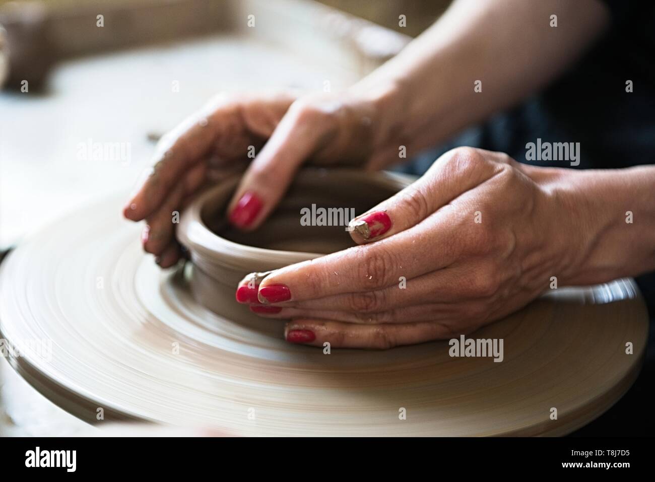 A lace maker and ceramicist create artwork. Hands top view Stock Photo ...