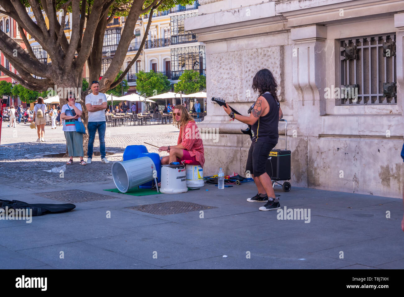 Busker girl playing guitar hi-res stock photography and images - Alamy