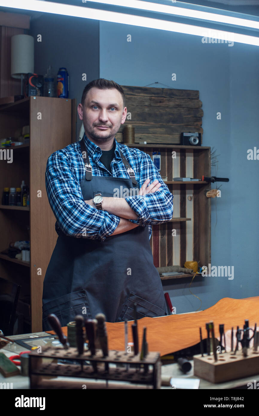 Concept of handmade craft production of leather goods Stock Photo - Alamy