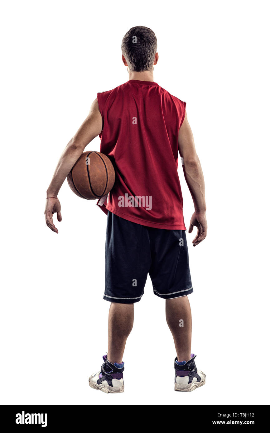 Basketball player standing back to camera with ball in hand isolated on ...