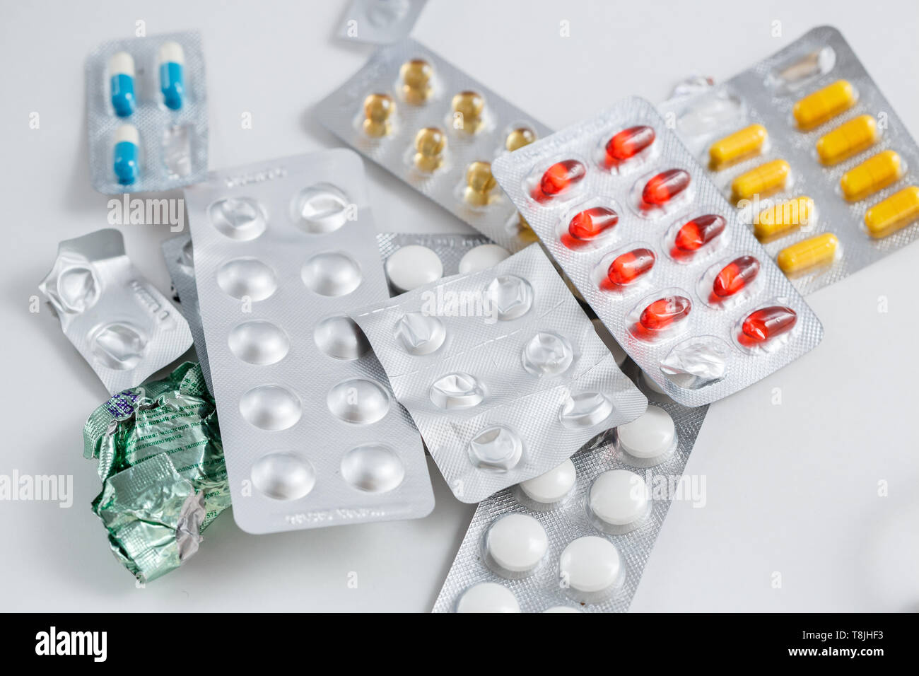 medicines in packages on white isolated background Stock Photo - Alamy