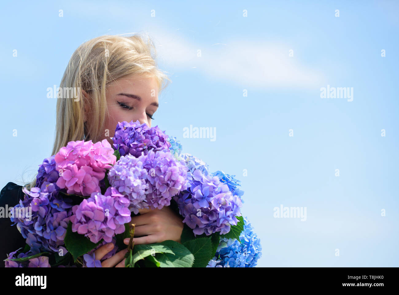 Woman sniff flowers bouquet hi-res stock photography and images - Alamy