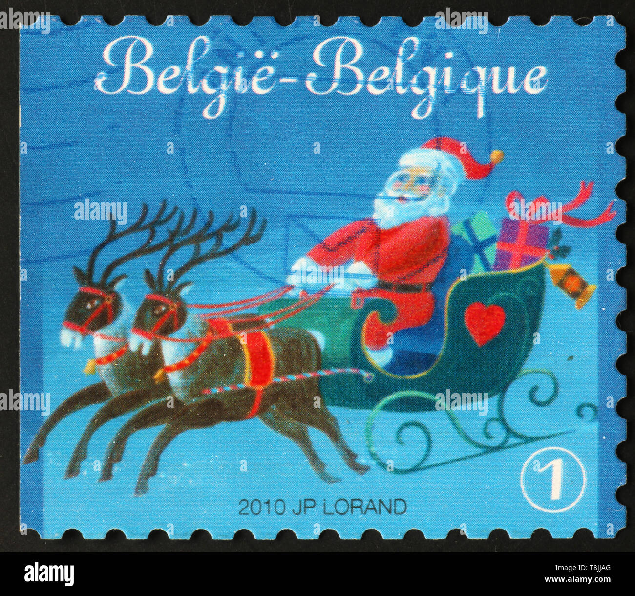 Santa Claus and his sleigh on belgian stamp Stock Photo - Alamy