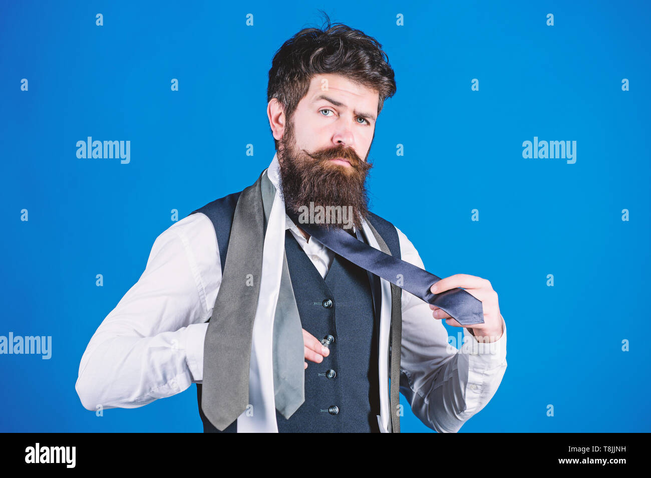How to match necktie with shirt and suit. Man bearded hipster hold few ...