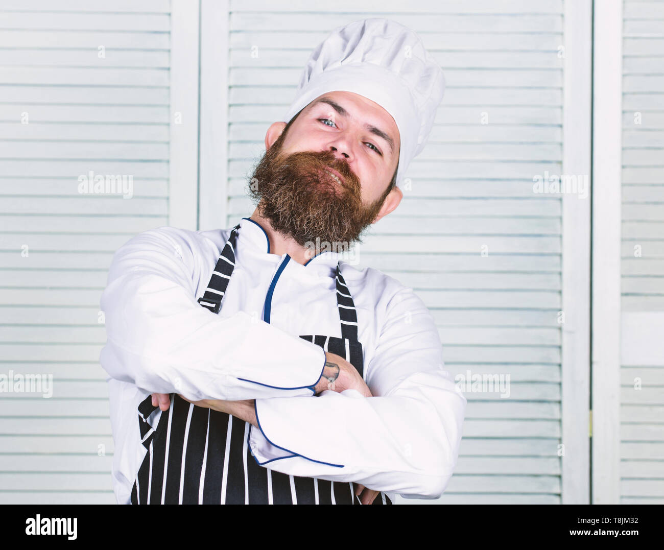 He is champion in the kitchen. Confident bearded strong chef white ...