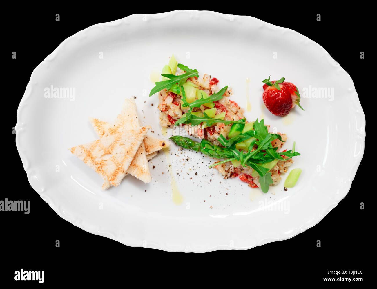 Seabass carpaccio isolated on black with clipping path Stock Photo - Alamy