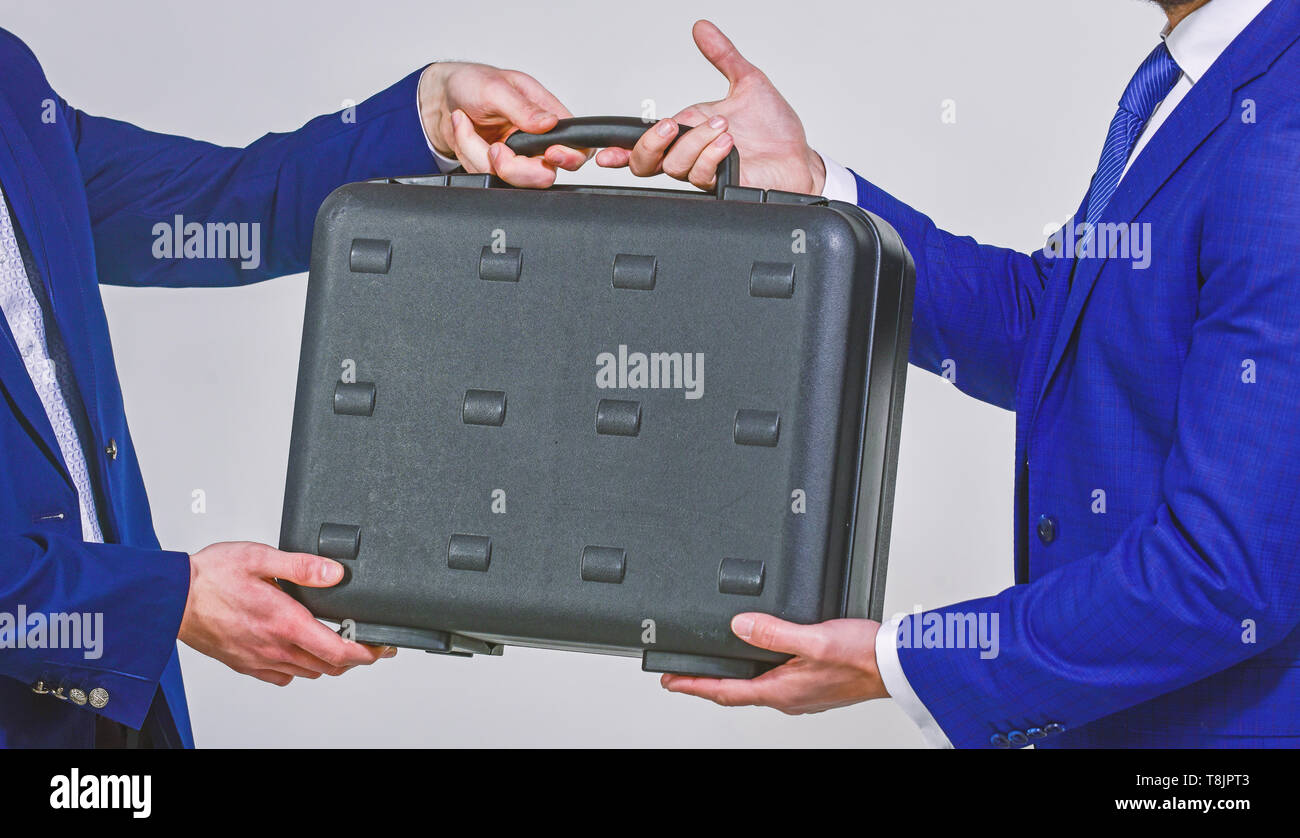 Business transfer concept. Male hand hold briefcase. Handover of case ...