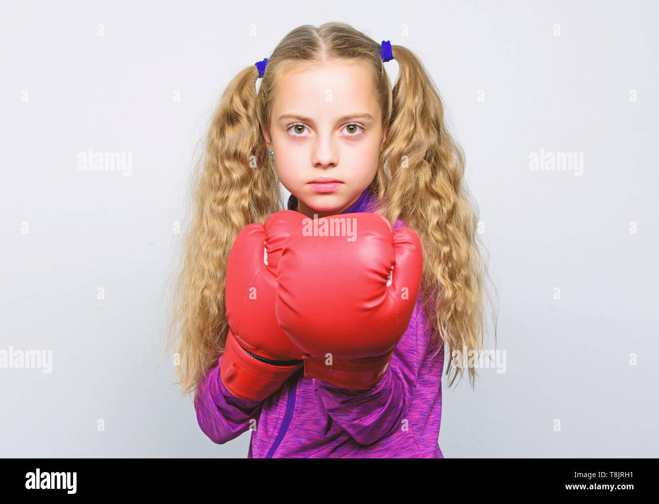 Girl cute child with red gloves posing on white background. Cute kid ...