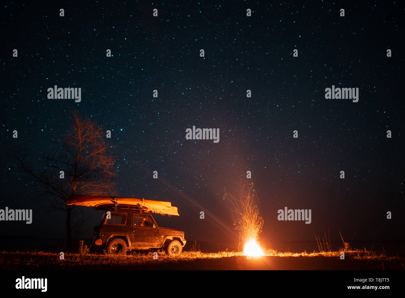 Night landscape with bright campfire and car Stock Photo - Alamy